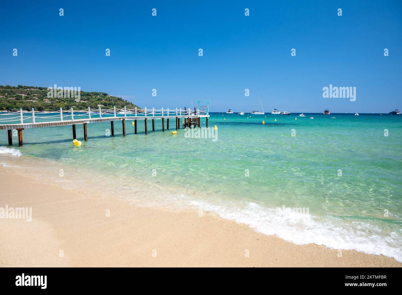 Wooden pier for guests of yachts on legendary Pampelonne beach near ...