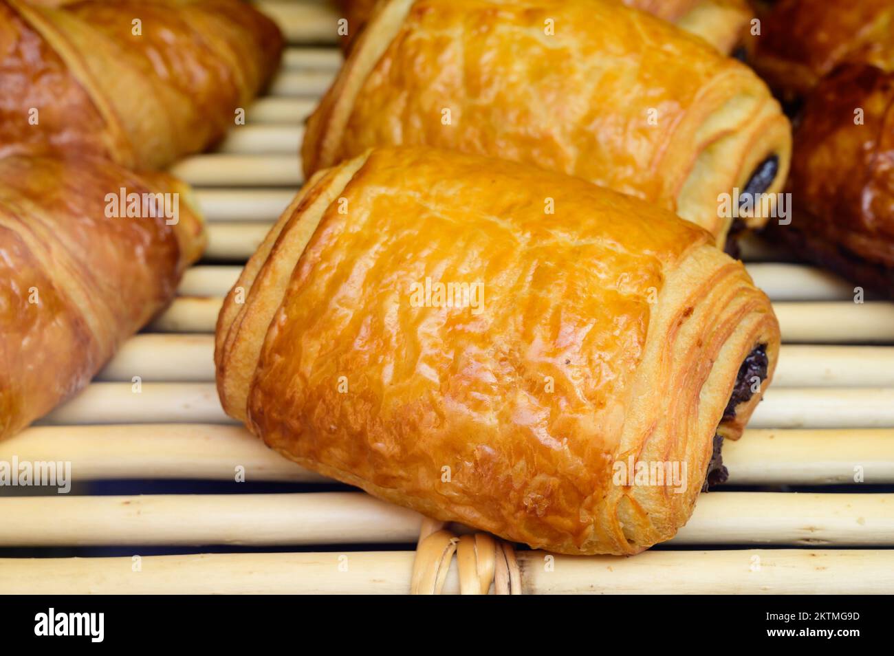 French bakery, fresh baked sweet buns and rolls on display in small ...