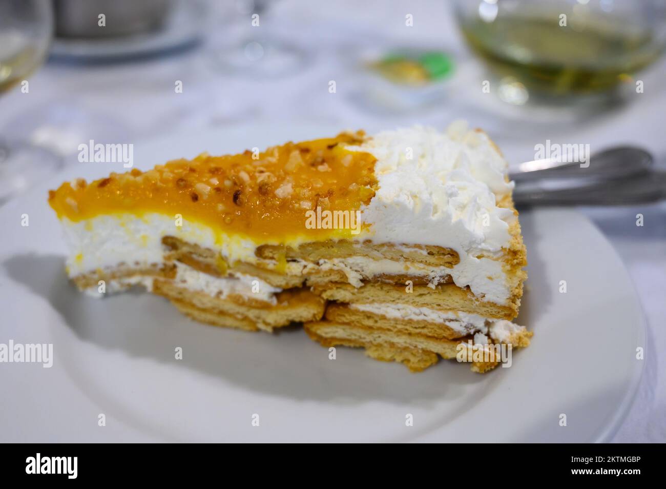 Traditional Portuguese cake with cream, fruits and cookies close up ...