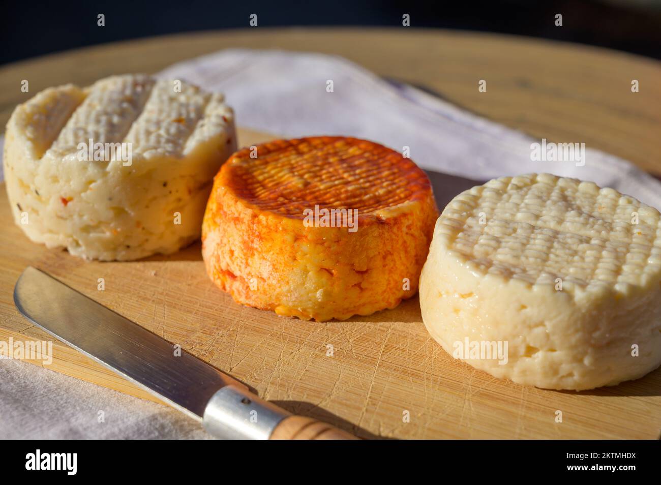 Variety of goat, sheep, cow cheeses made with paprika, herbs in ...