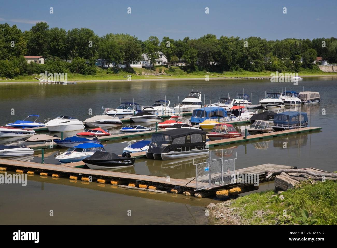 Small yachts and pleasure craft moored at a marina on the Mille-Iles ...