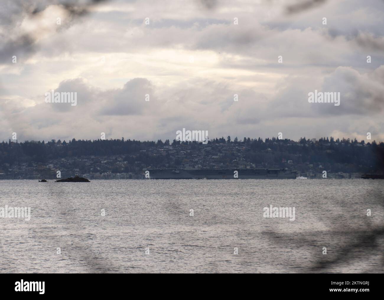 The aircraft carrier USS Nimitz (CVN 68) transits the Puget Sound after ...
