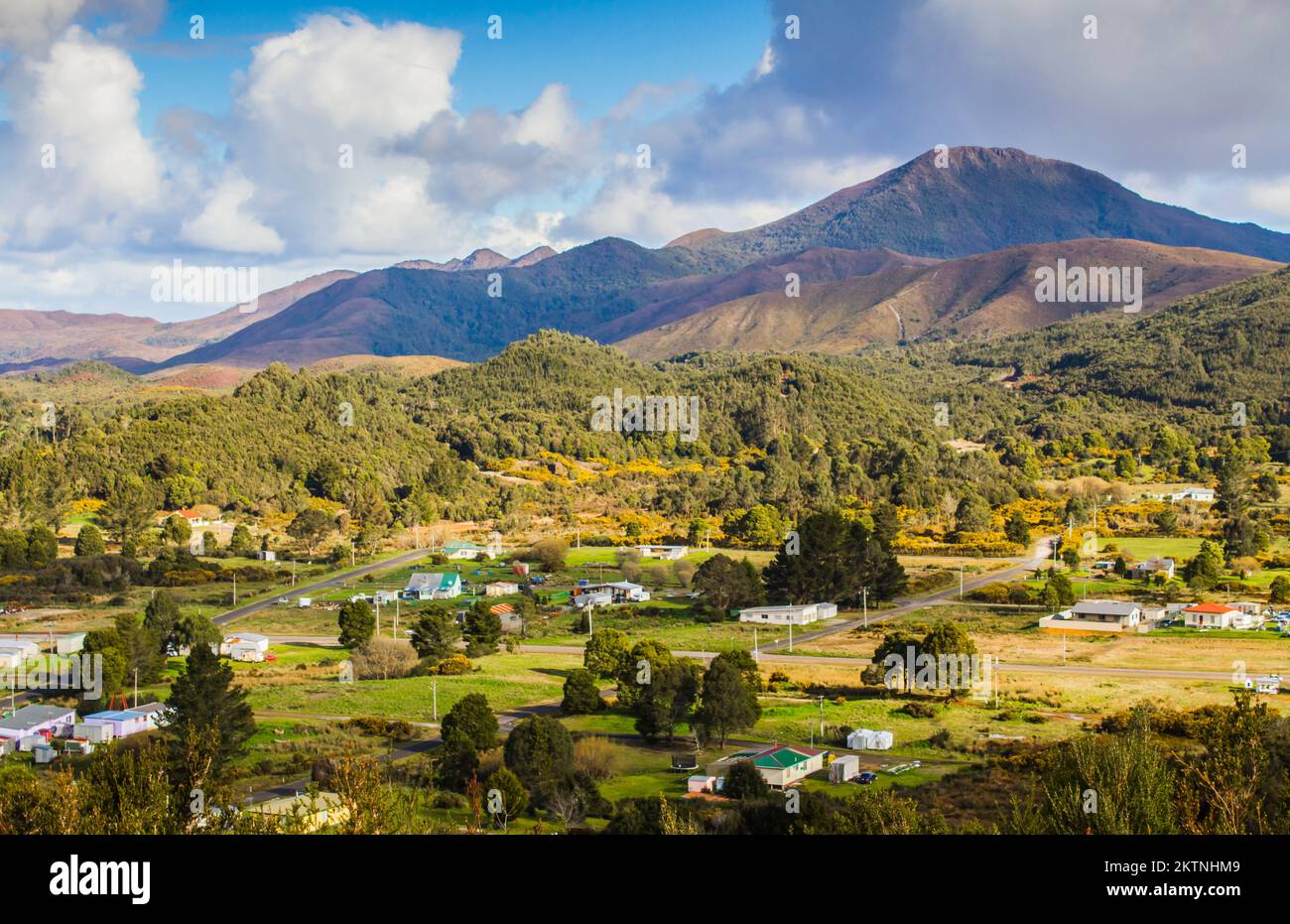 Landscape of Zeehan Country Town in valley at the foot of the mountain ...