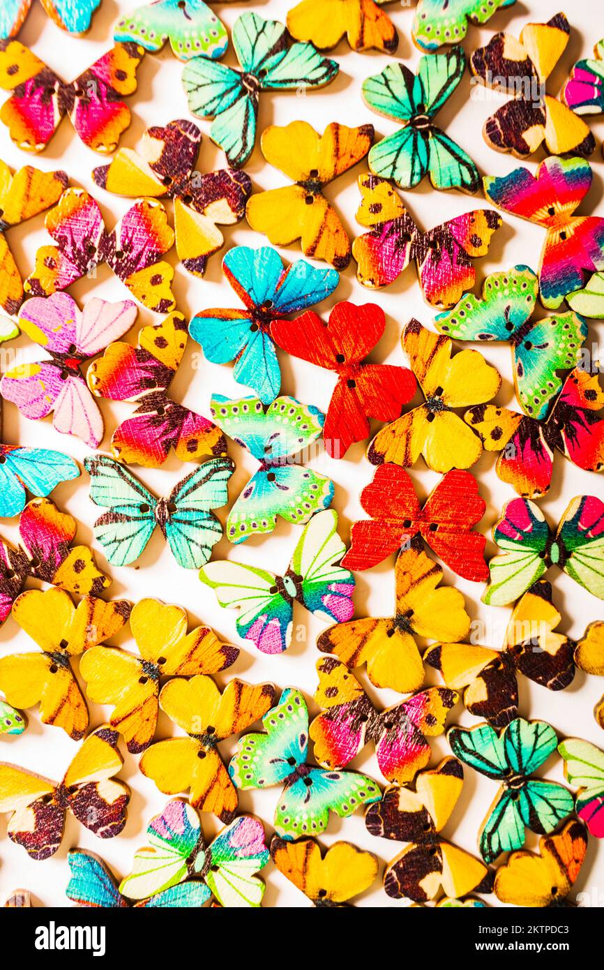 Saturated still life artwork on a mix of button butterflies in abstract ...
