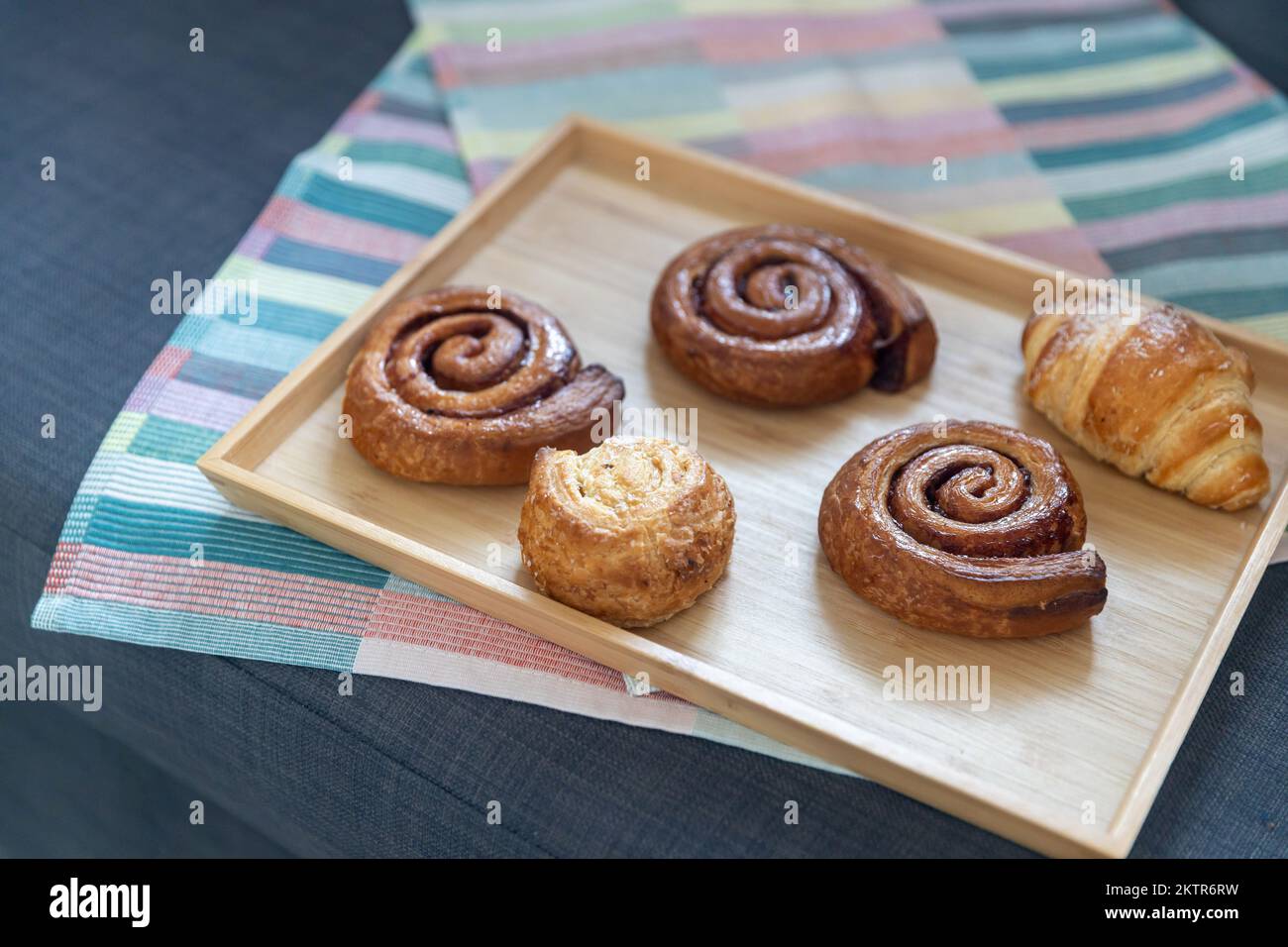 Homemade cinnamon buns with spices and caramel on parchment paper Stock ...
