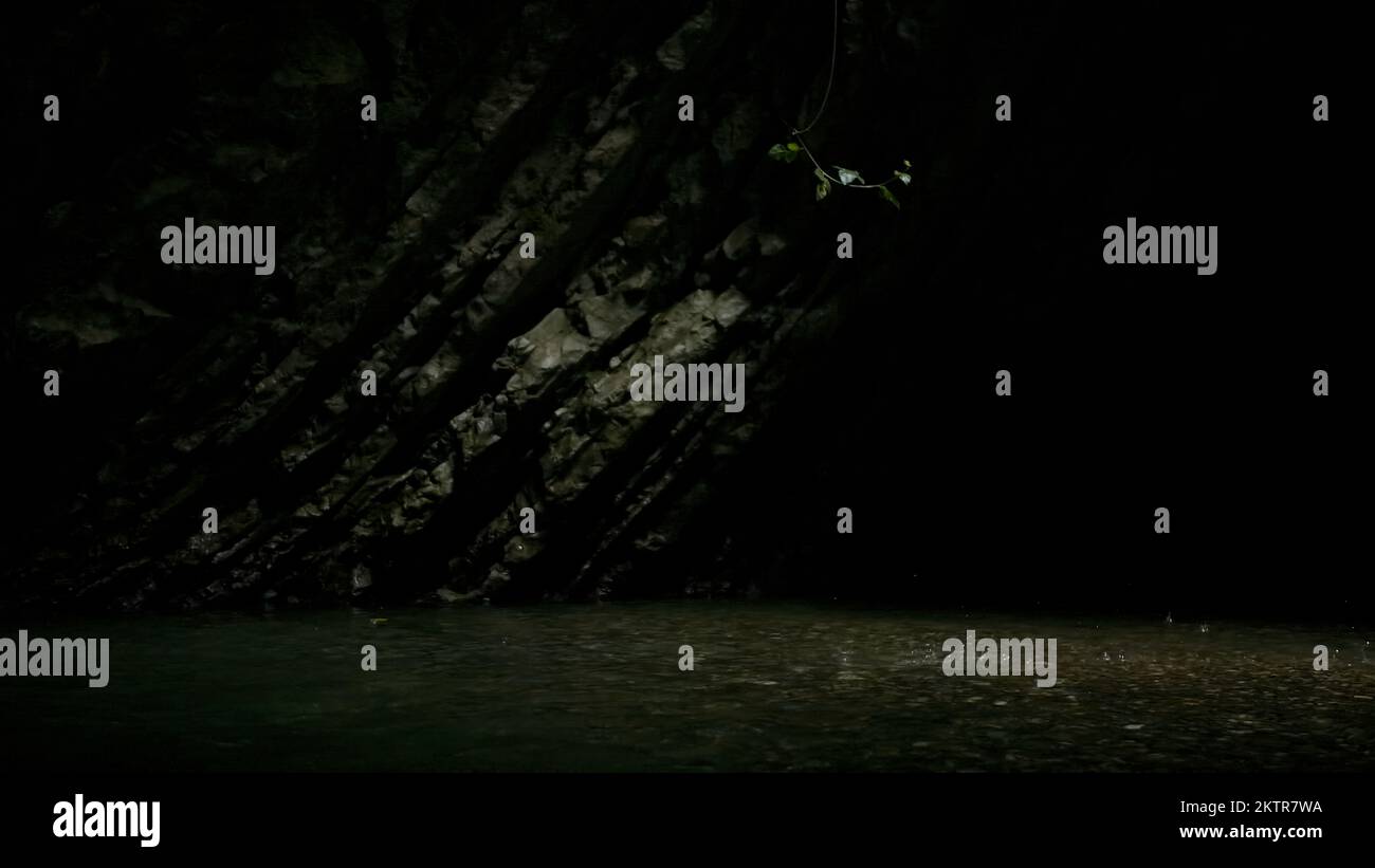 A large cave. Creative.A huge rock from which cold drops drip into the ...