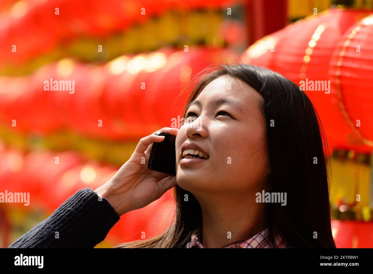 Chinese woman talking on cell phone during chinese new year Stock Photo ...