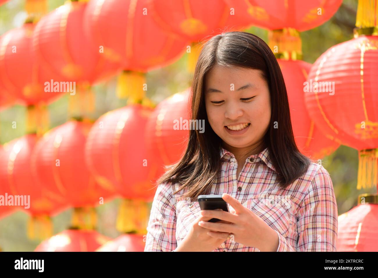 Chinese woman talking on cell phone during chinese new year Stock Photo ...