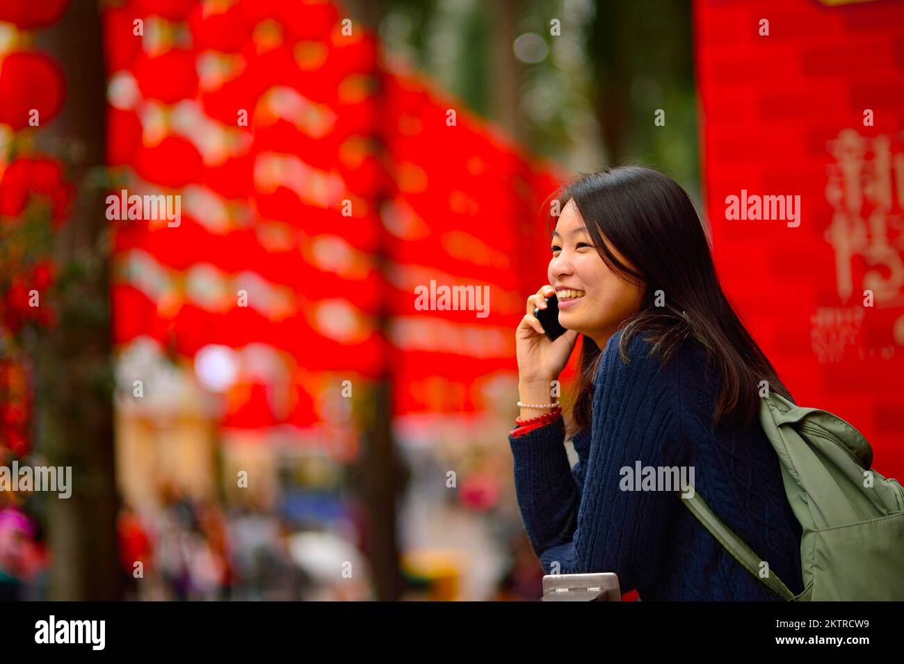 Chinese woman talking on cell phone during chinese new year Stock Photo ...