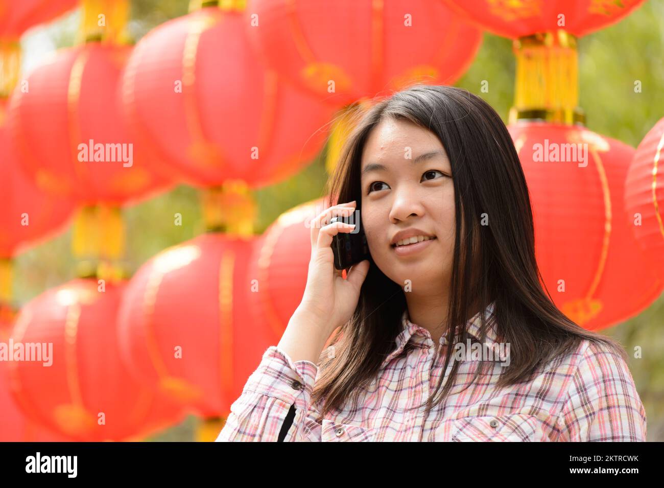 Chinese woman talking on cell phone during chinese new year Stock Photo ...