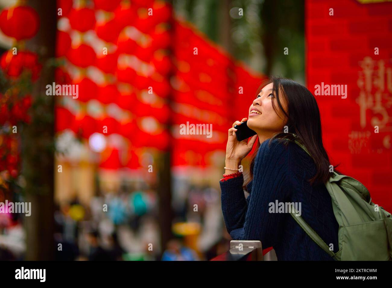 Chinese woman talking on cell phone during chinese new year Stock Photo ...