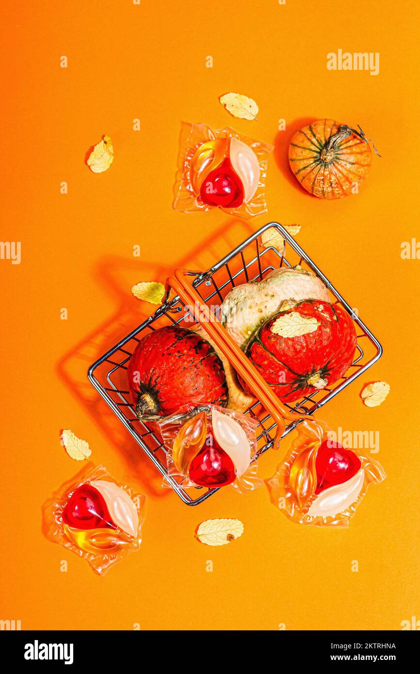 Sale concept for machine washing. Capsules with detergent and autumn ...