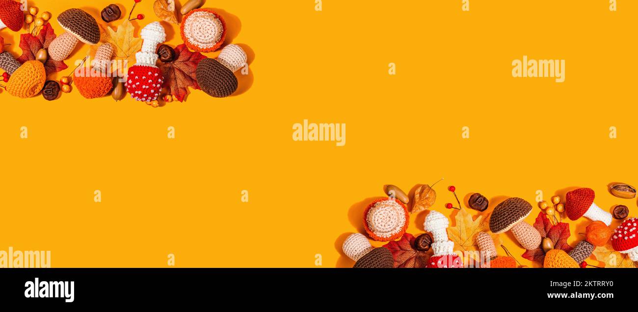 Traditional autumn background. Assorted of different knitted mushrooms ...