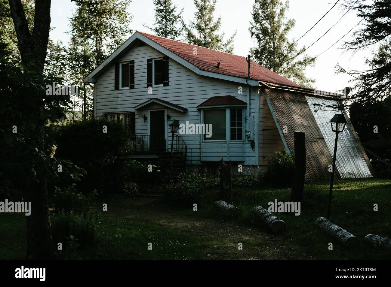 Tiny house on side of a lake Stock Photo - Alamy