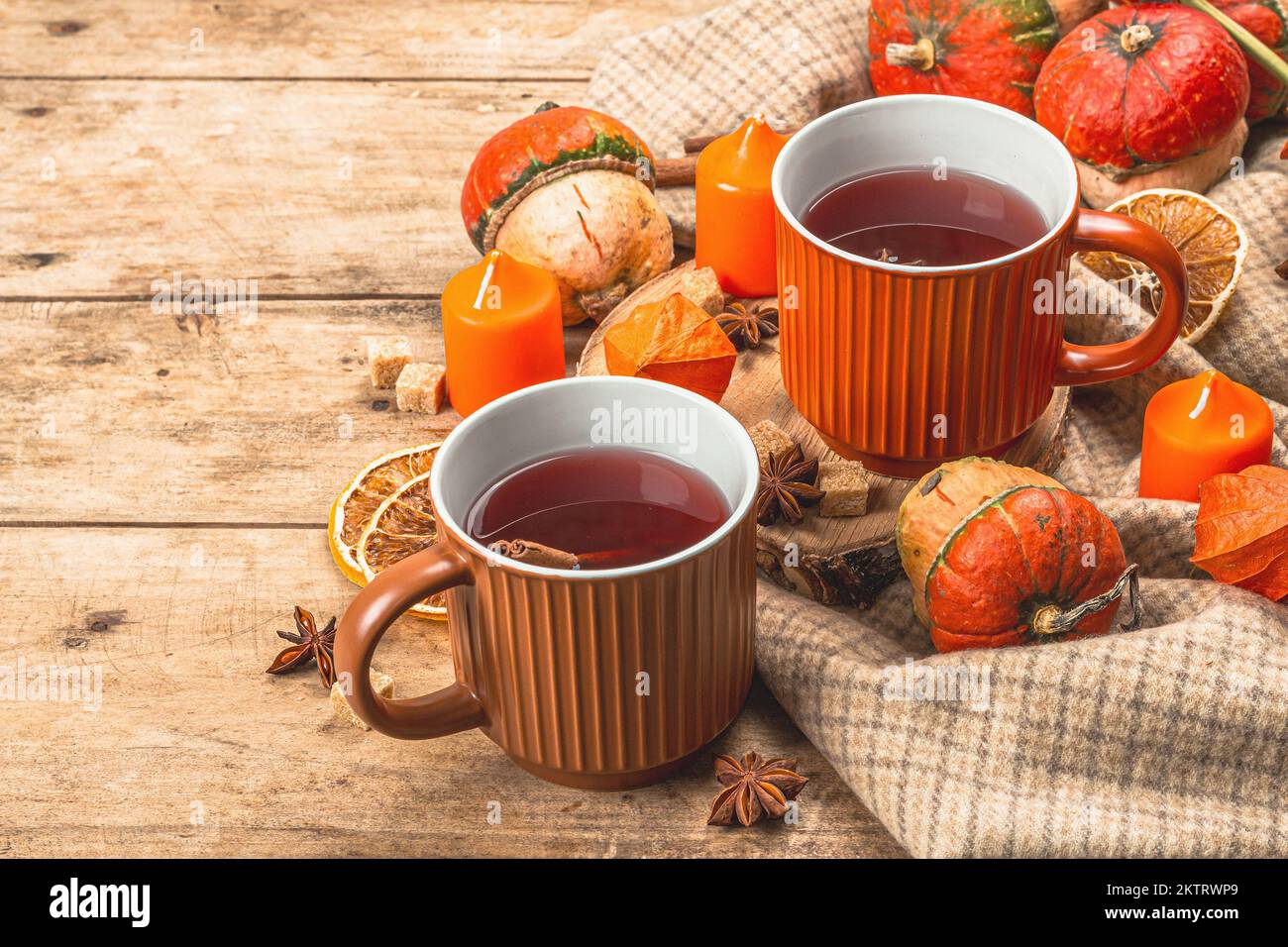 Spicy hot tea. Autumn good mood, traditional fall beverage in cups ...