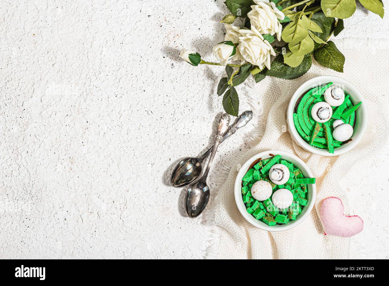 Vegan dessert with mushroom decor. Romantic arrangement, roses bouquet ...