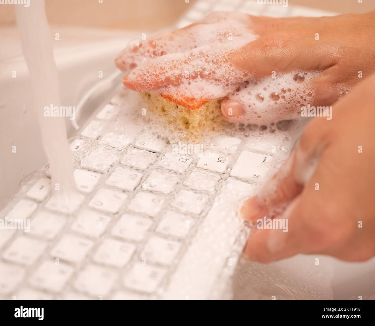Woman washing white computer keyboard hi-res stock photography and ...