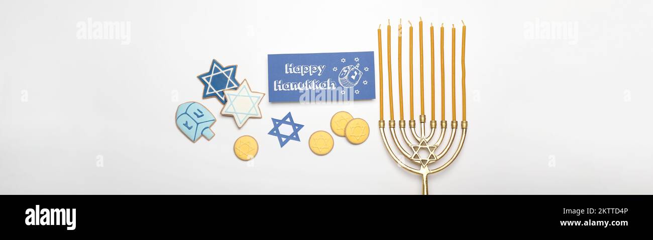 Different symbols of Hanukkah and greeting card on white background ...
