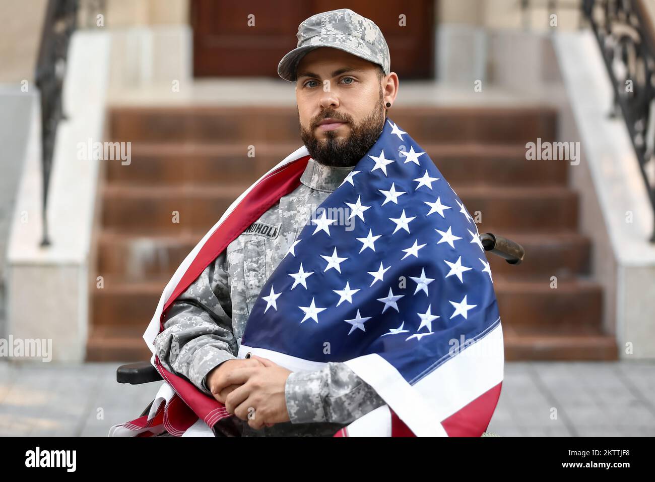 Young soldier in wheelchair with USA flag outdoors Stock Photo - Alamy