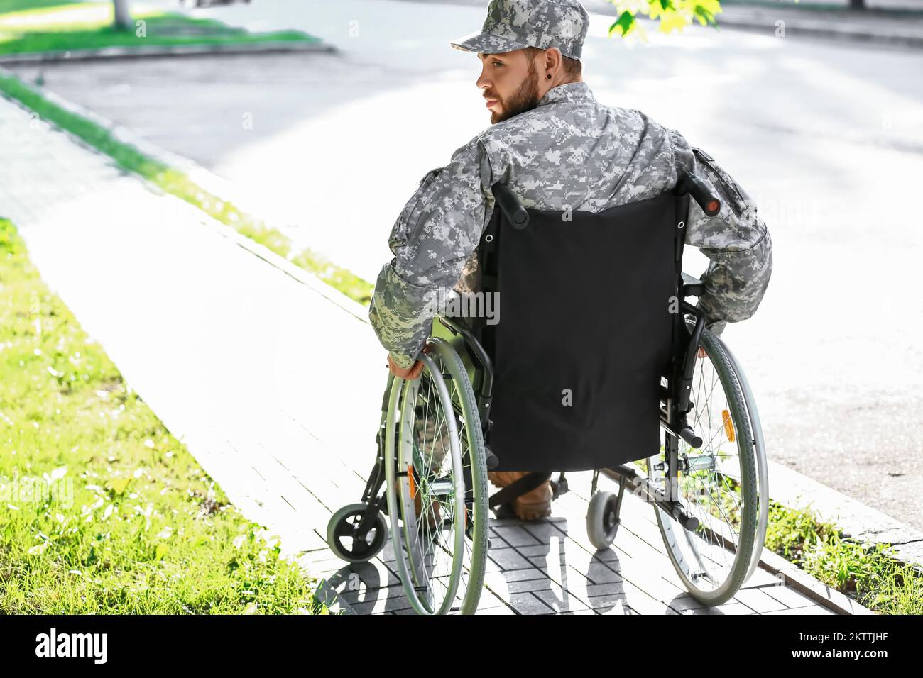Young soldier in wheelchair outdoors Stock Photo - Alamy