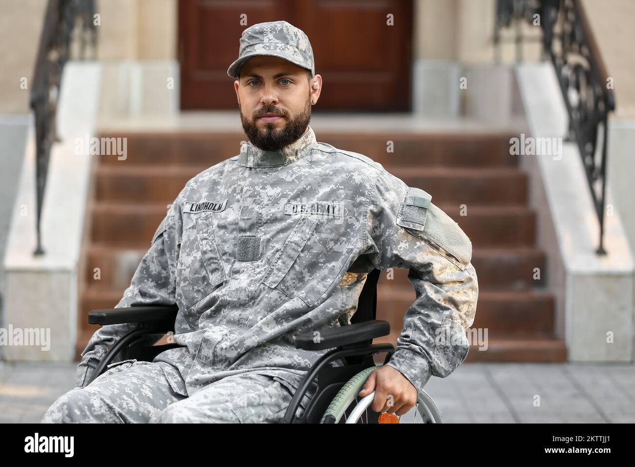 Young soldier in wheelchair on street Stock Photo - Alamy