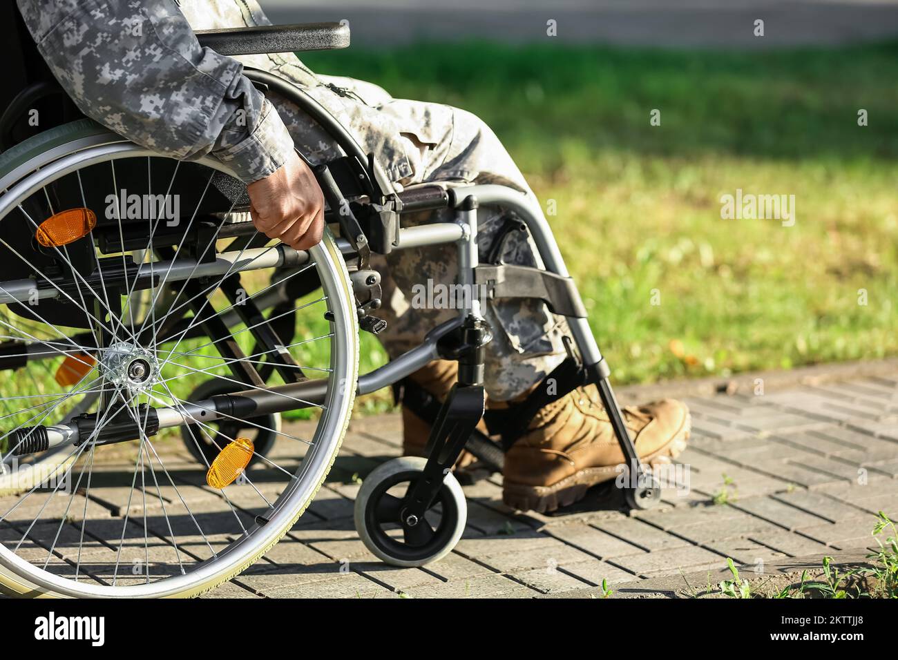 Young soldier in wheelchair outdoors Stock Photo - Alamy