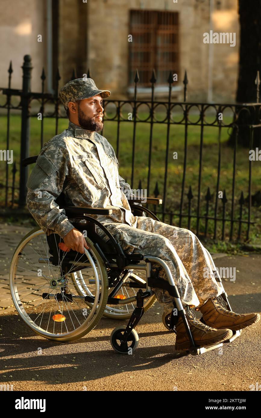 Young soldier in wheelchair on street Stock Photo - Alamy