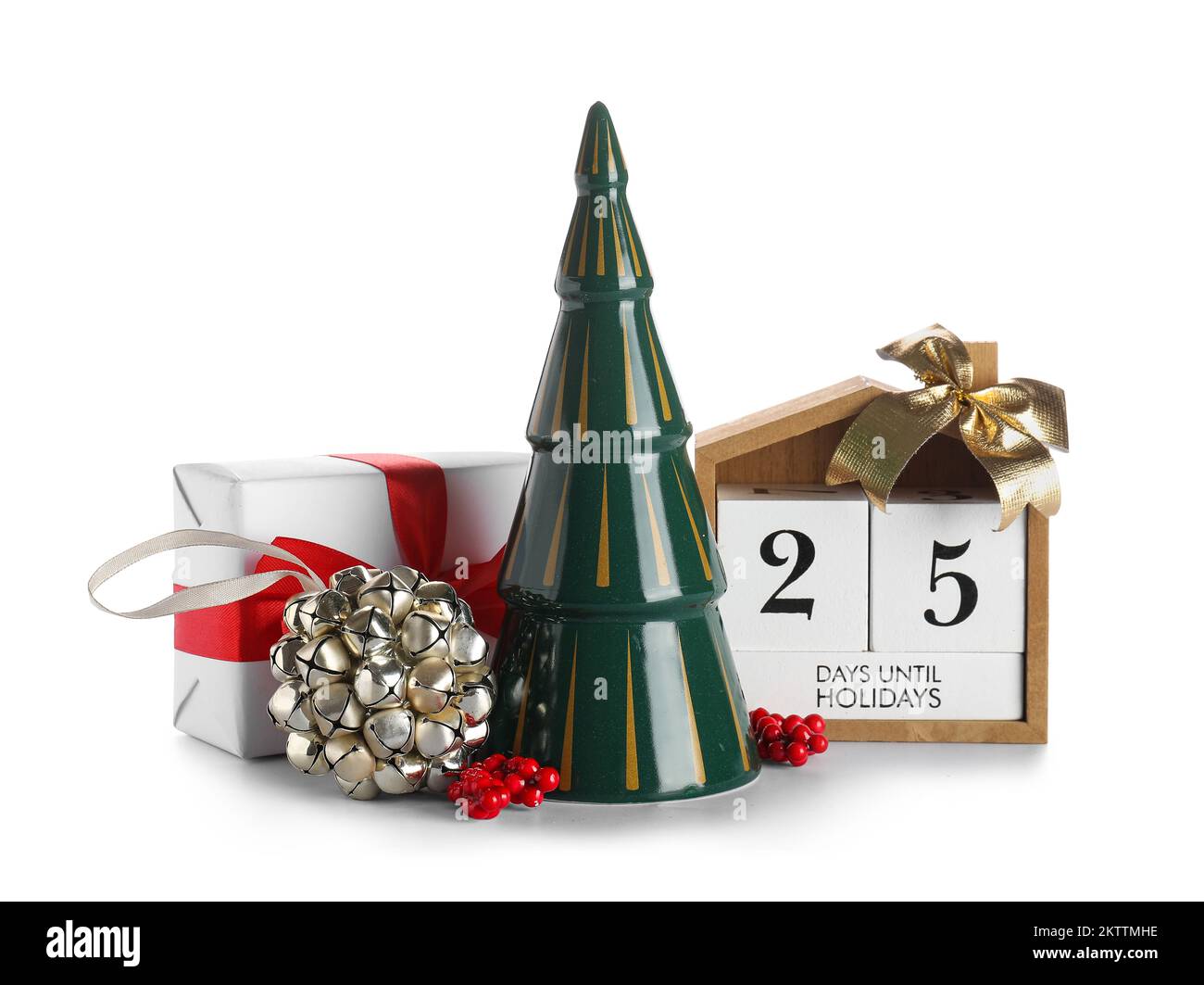 Composition with ceramic Christmas tree, calendar, gift box and ...