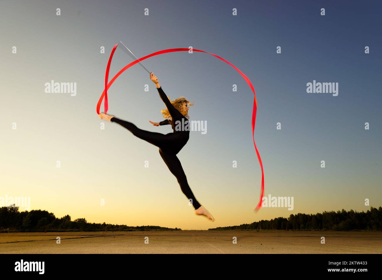 Professional gymnast woman dancer with ribbon Stock Photo - Alamy