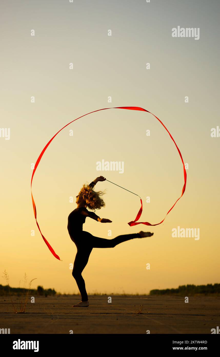 Professional gymnast woman dancer with ribbon Stock Photo - Alamy
