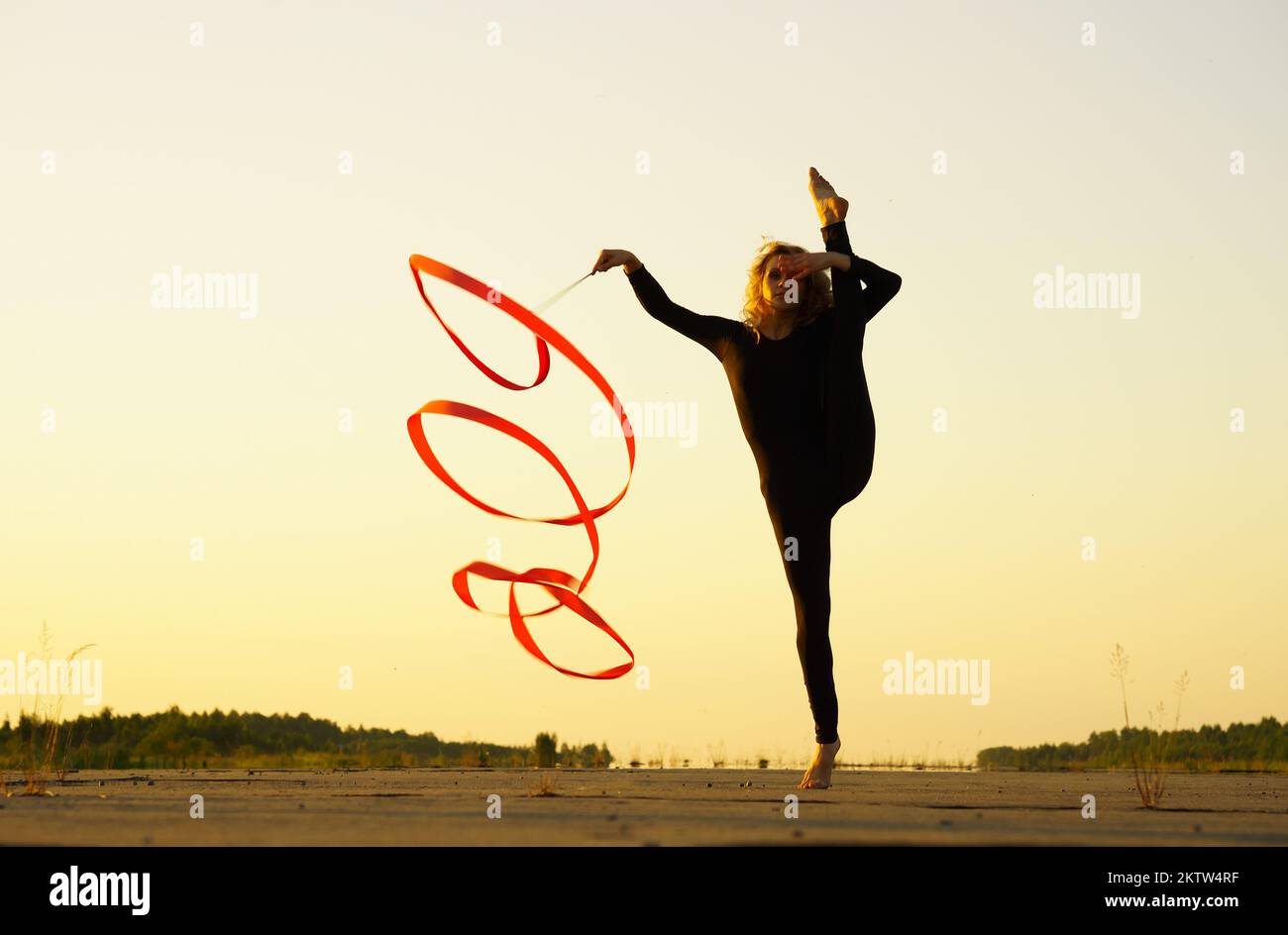 Professional gymnast woman dancer with ribbon Stock Photo - Alamy