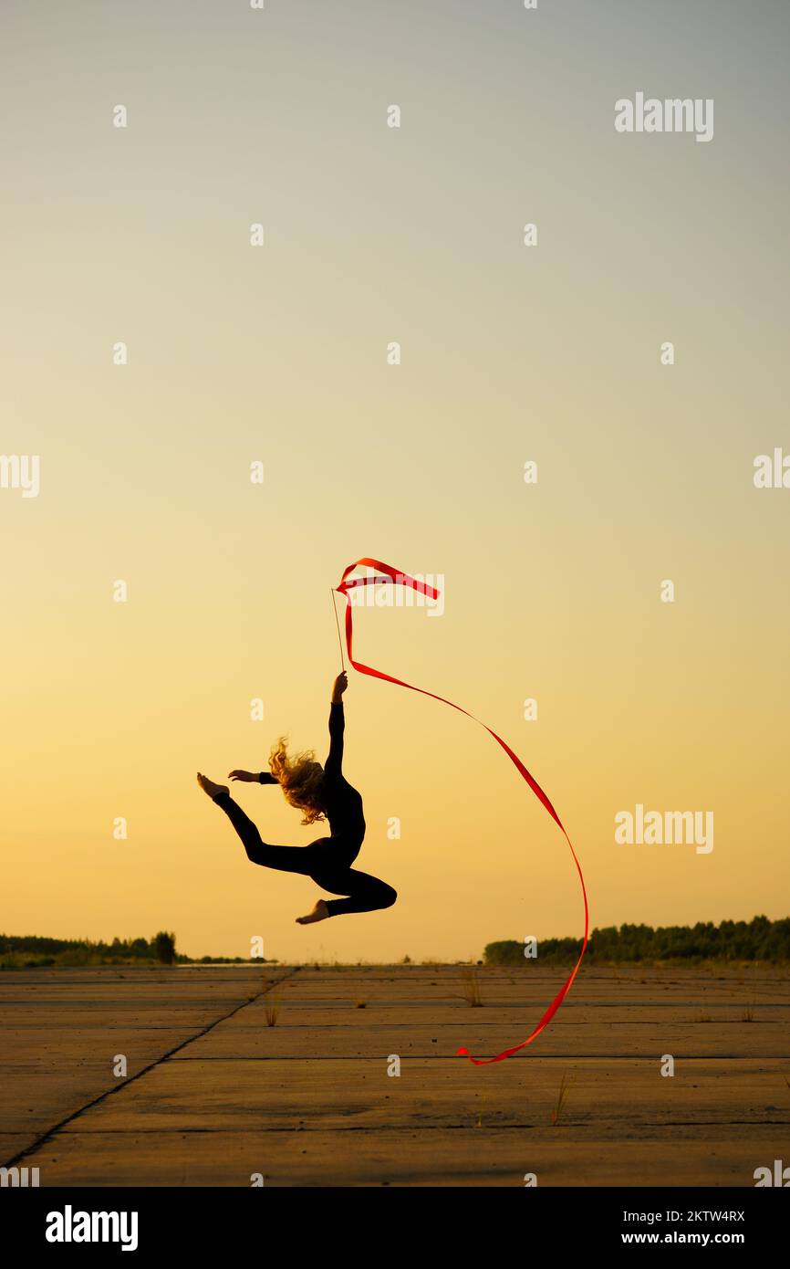 Professional gymnast woman dancer with ribbon Stock Photo - Alamy