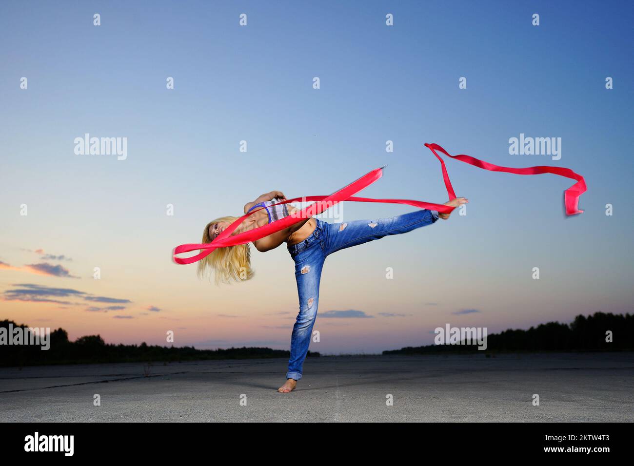 Professional gymnast woman at night Stock Photo - Alamy