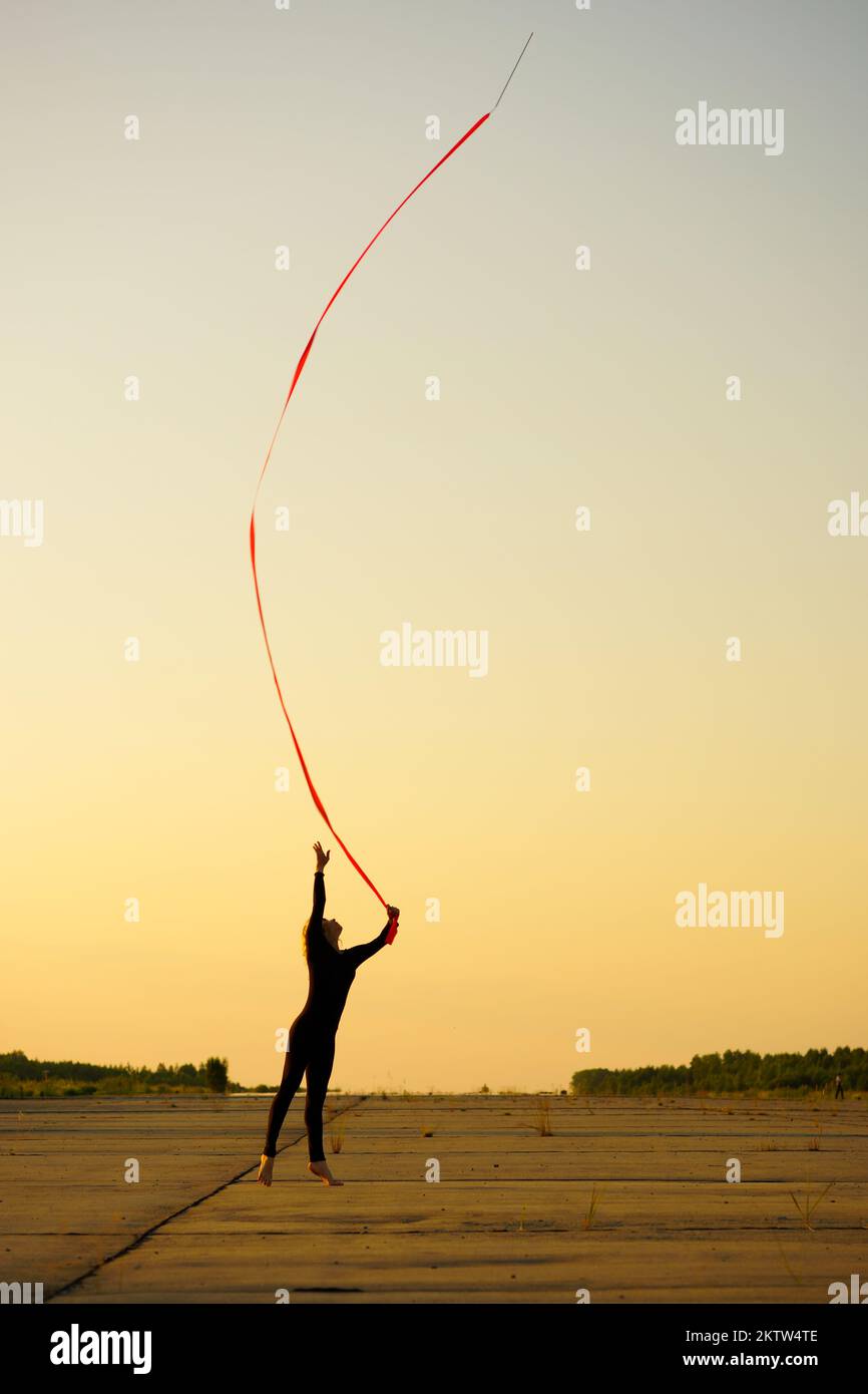 Professional gymnast woman dancer with ribbon Stock Photo - Alamy