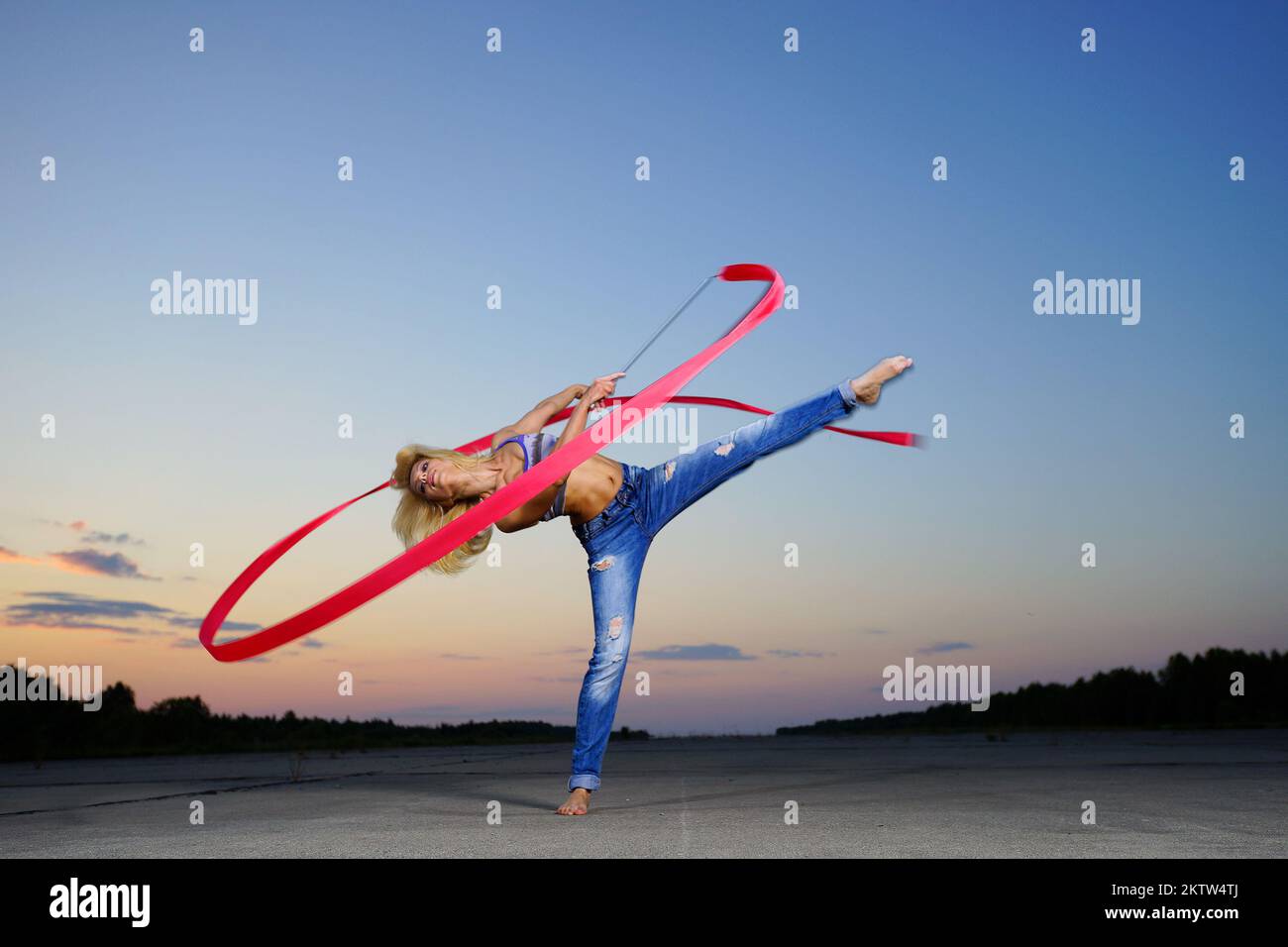 Professional gymnast woman at night Stock Photo - Alamy