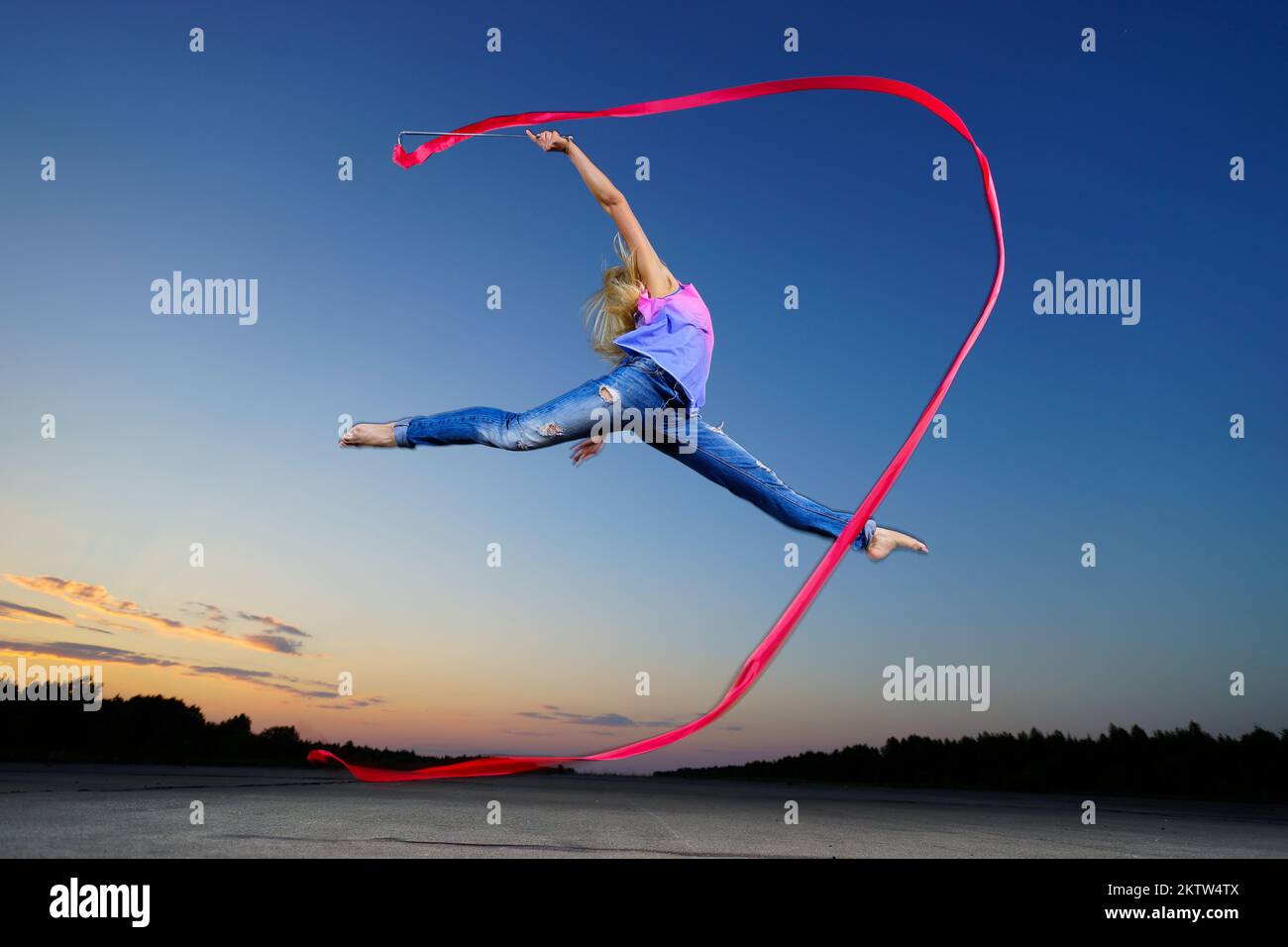 Professional gymnast woman at night Stock Photo - Alamy