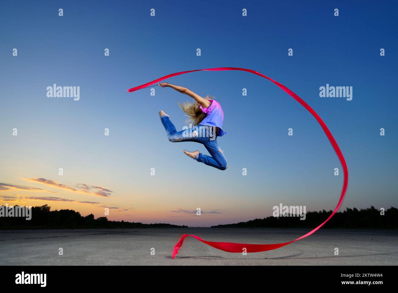 Professional gymnast woman at night Stock Photo - Alamy