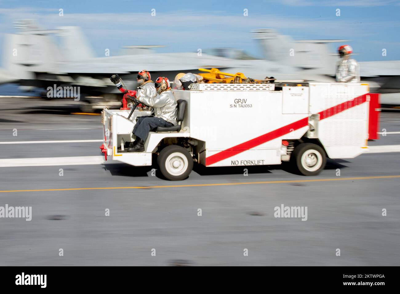 Us navy flight deck tractor hi-res stock photography and images - Alamy