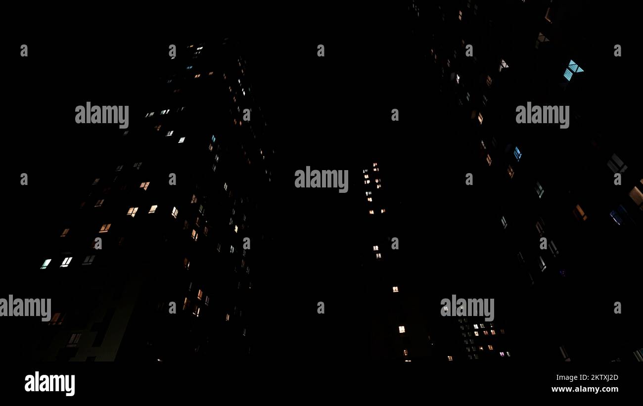 Night background of a big city with high rise residential buildings and ...