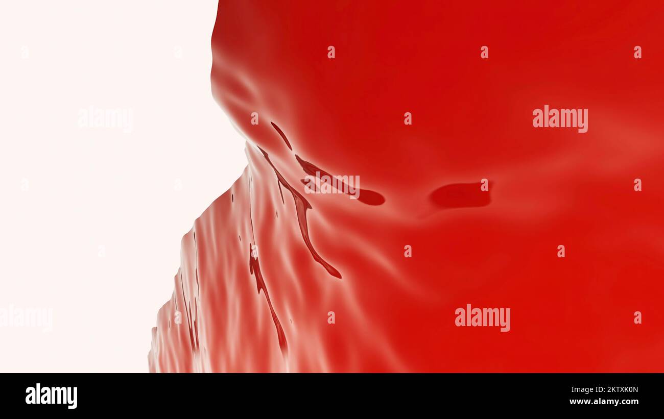 Close up of red rippling red jelly substance on a white background ...