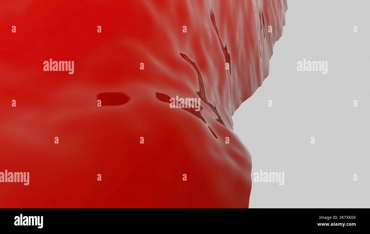 Close up of red rippling red jelly substance on a white background ...