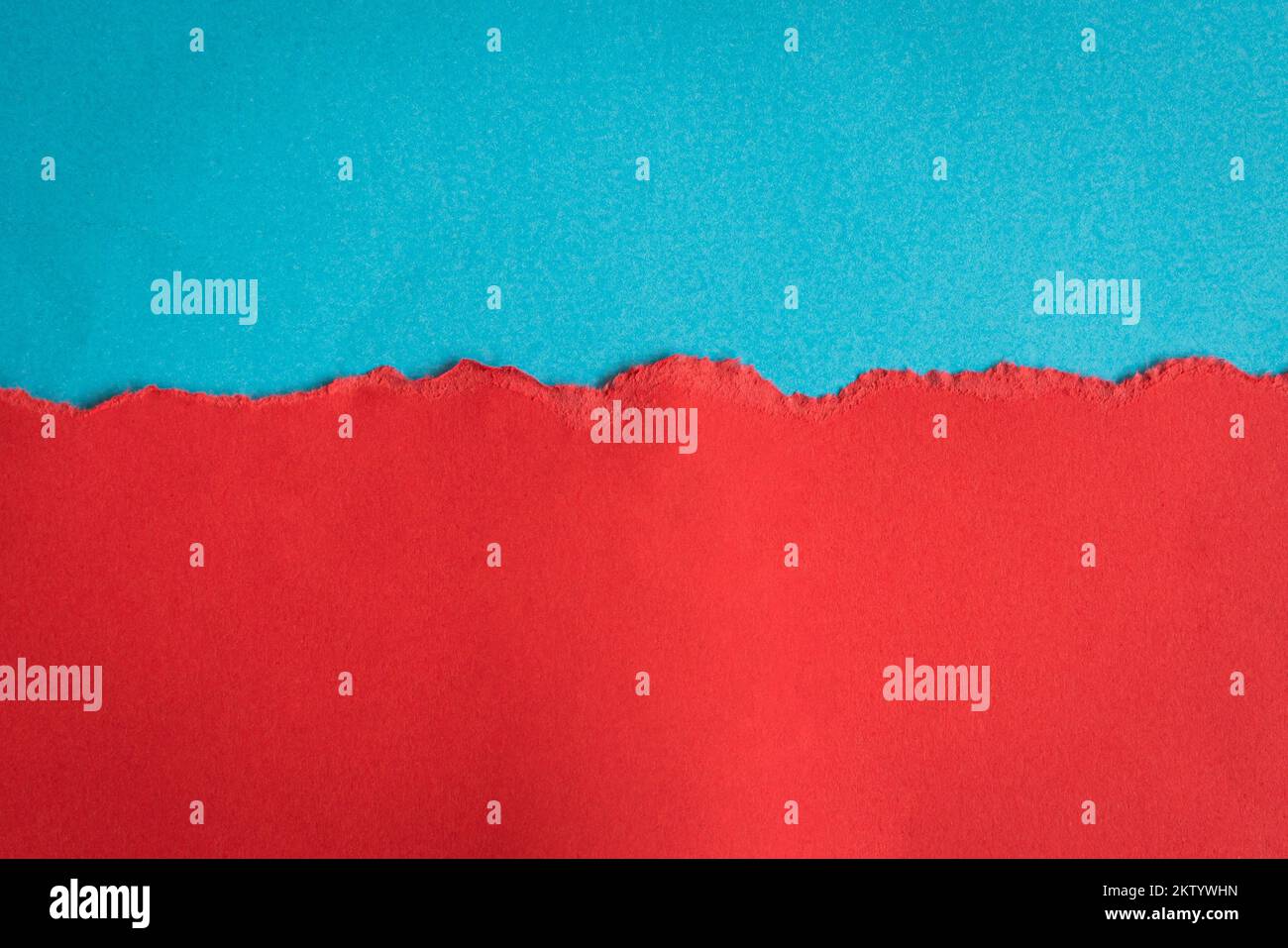 Torn half sheet red paper horizontal on blue paper at the bottom. As ...