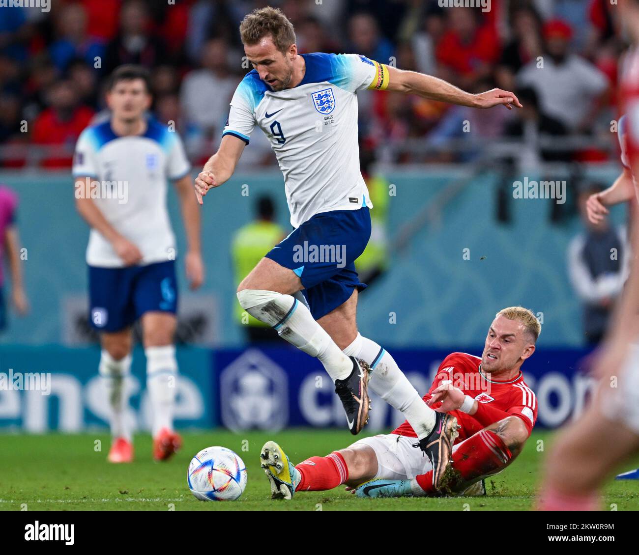 Harry Kane of England jumps over Aaron RAMSEY of Wales during the FIFA ...