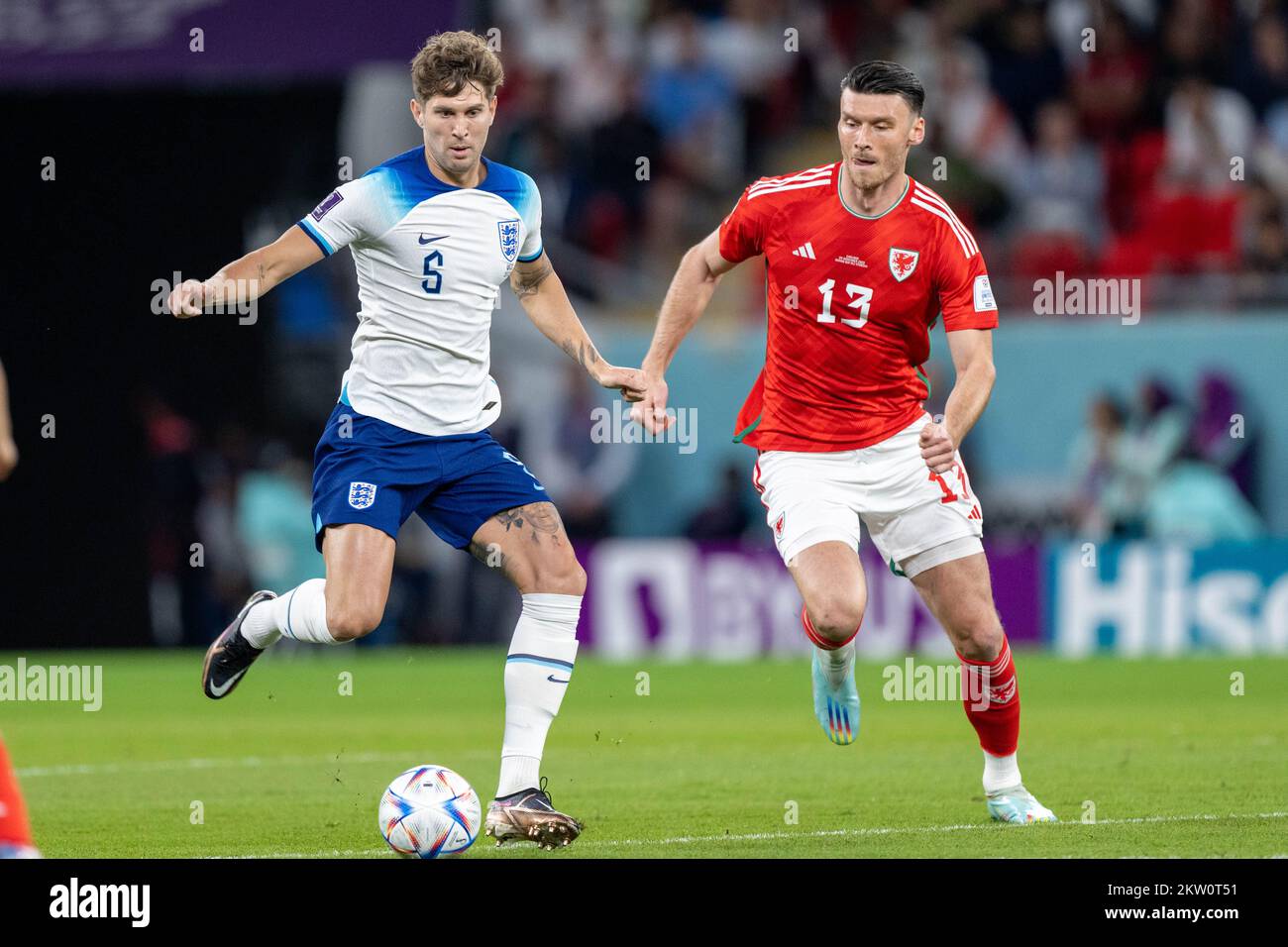 John Stones of England and Kieffer MOORE of Wales during the FIFA World ...