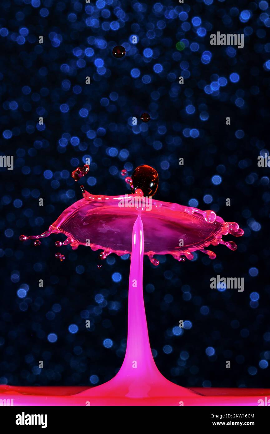 pink water droplet on black back ground Stock Photo - Alamy