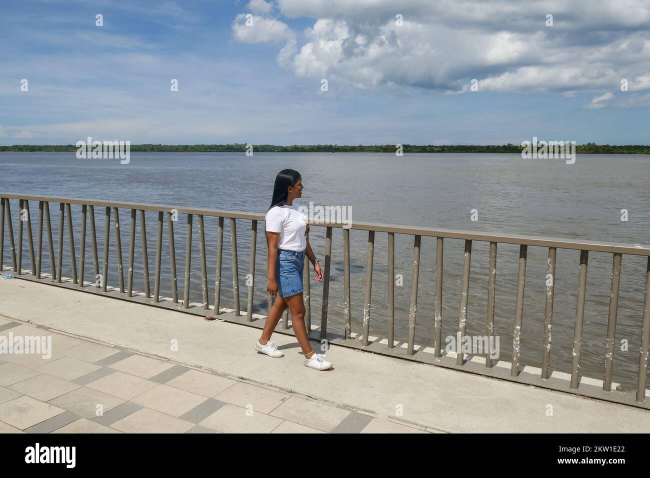 Portrait of a woman walking along the promenade in Barranquilla Stock ...