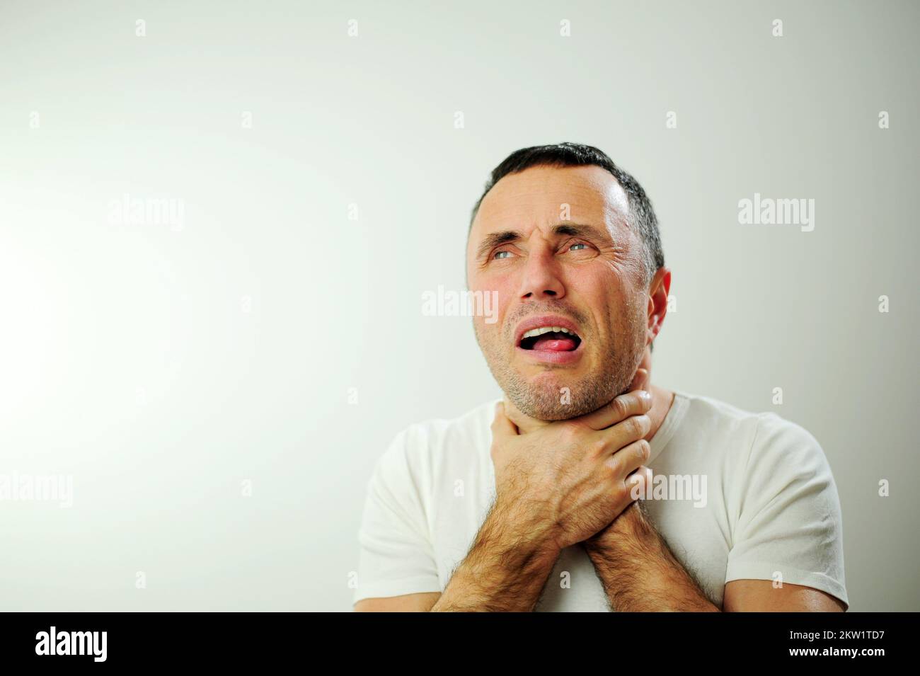 Hard to swallow Depressed young man drowning himself man having sore ...