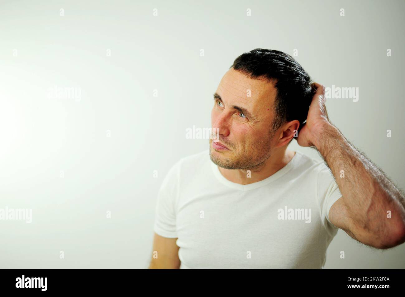 Man back view scratching head hi-res stock photography and images - Alamy