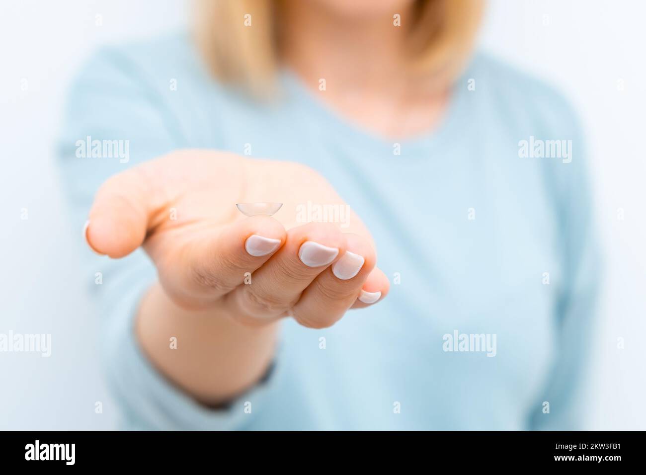 Close up contact eye lens on the tip of the finger Stock Photo - Alamy