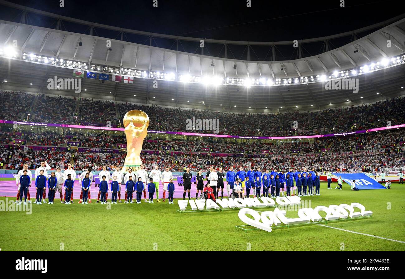 England (R) and Wales players line up ahead of a World Cup Group B ...